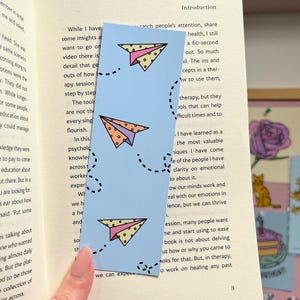 Paper Aeroplanes Bookmark. A Cute Blue Bookmark With Paper Planes ...