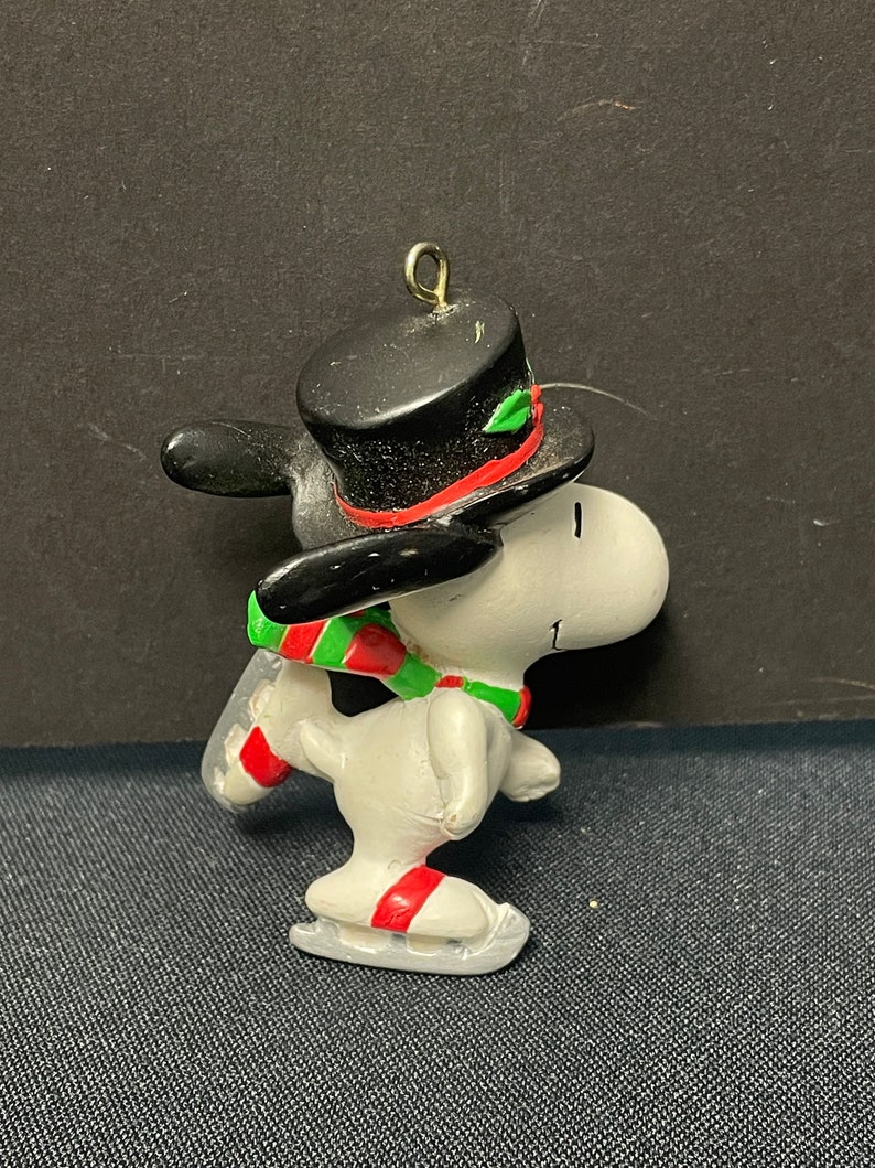 Peanuts Snoopy Ice Skating in a Top Hat Green and Red Scarf Christmas ...