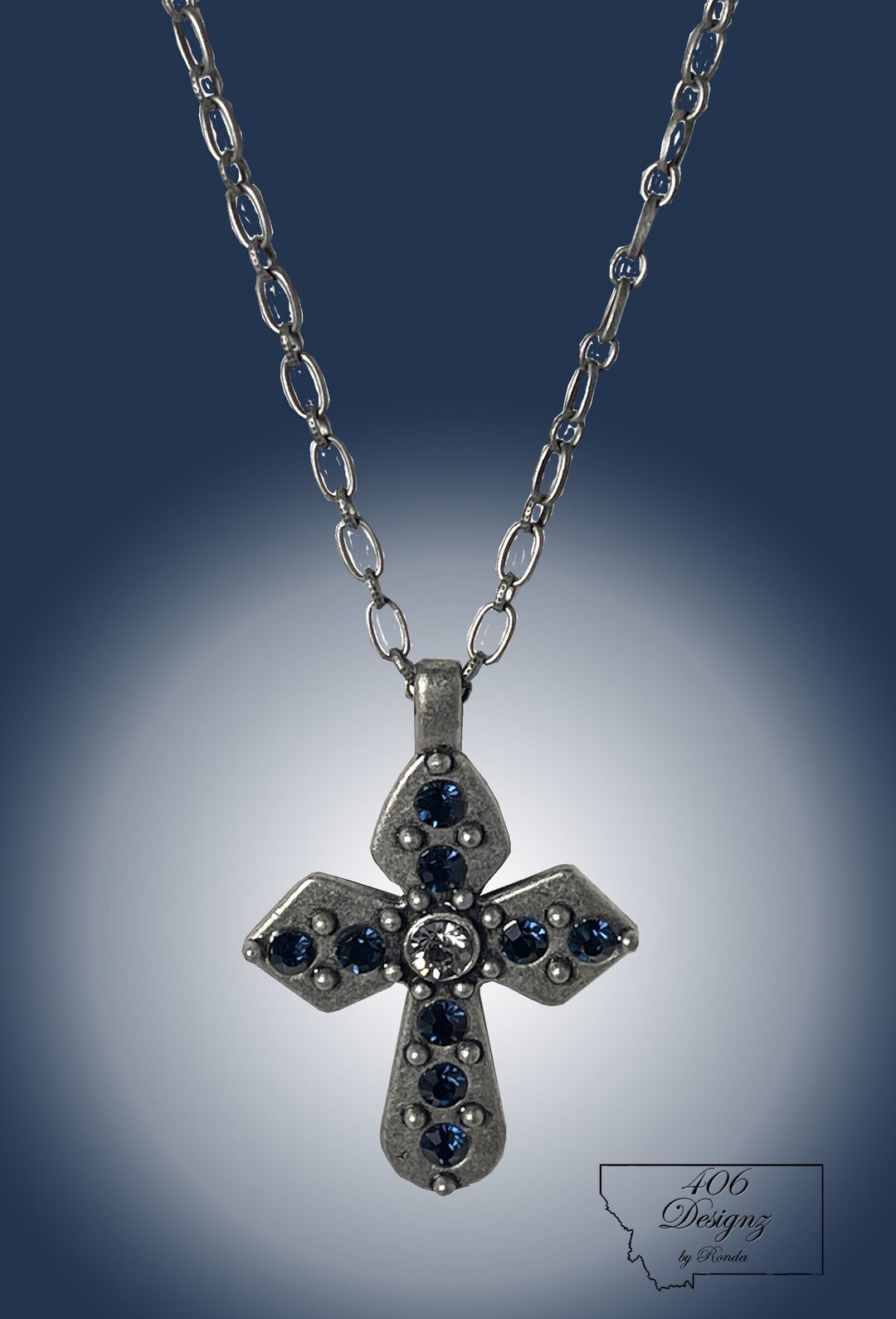 Gray Metal Cross With Clear and Dark Blue Crystals on Gun Metal Gray ...