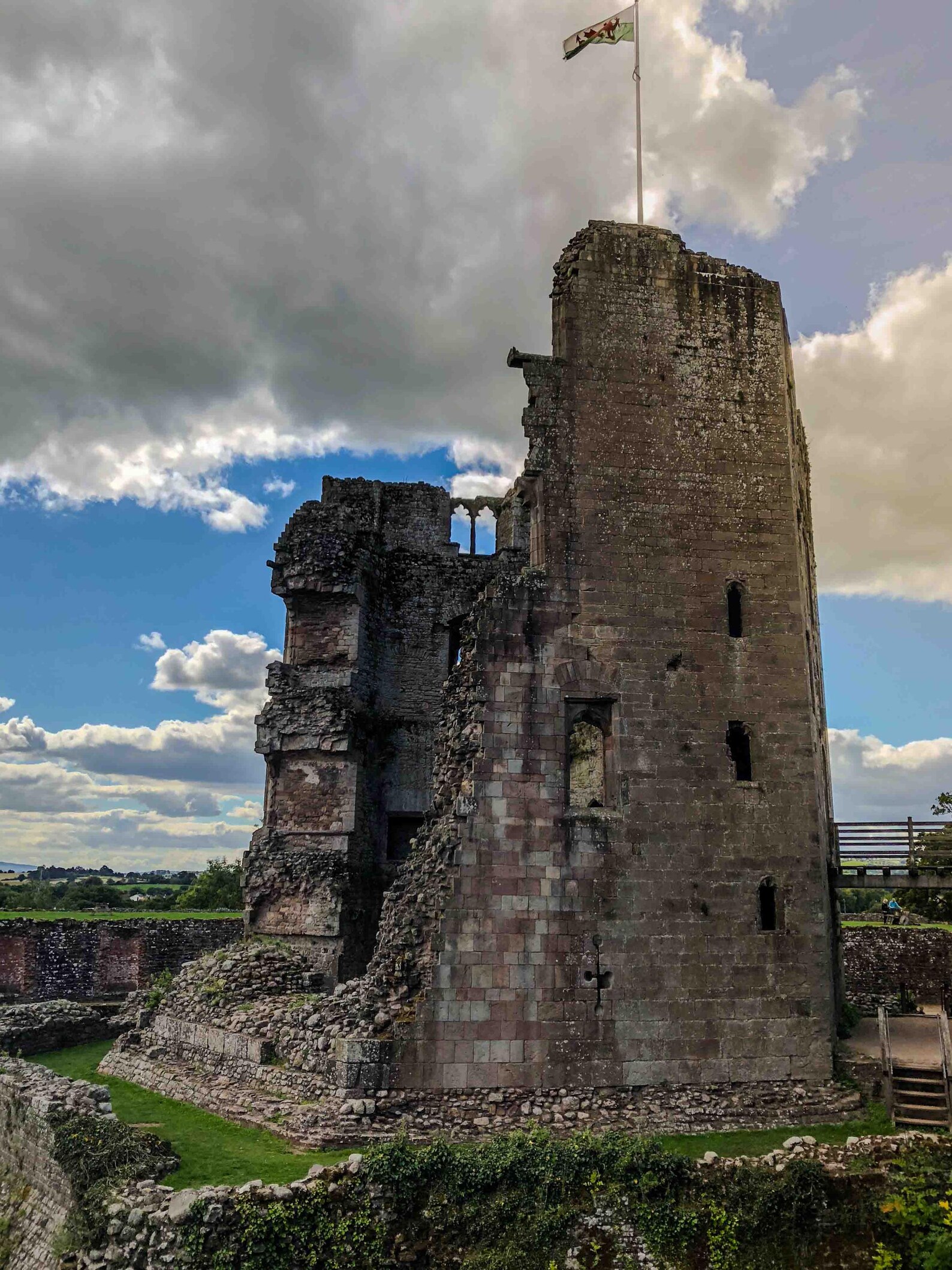Defiant Dragon: Welsh Flag Soars Above Raglan Castle's Crumbling Tower ...