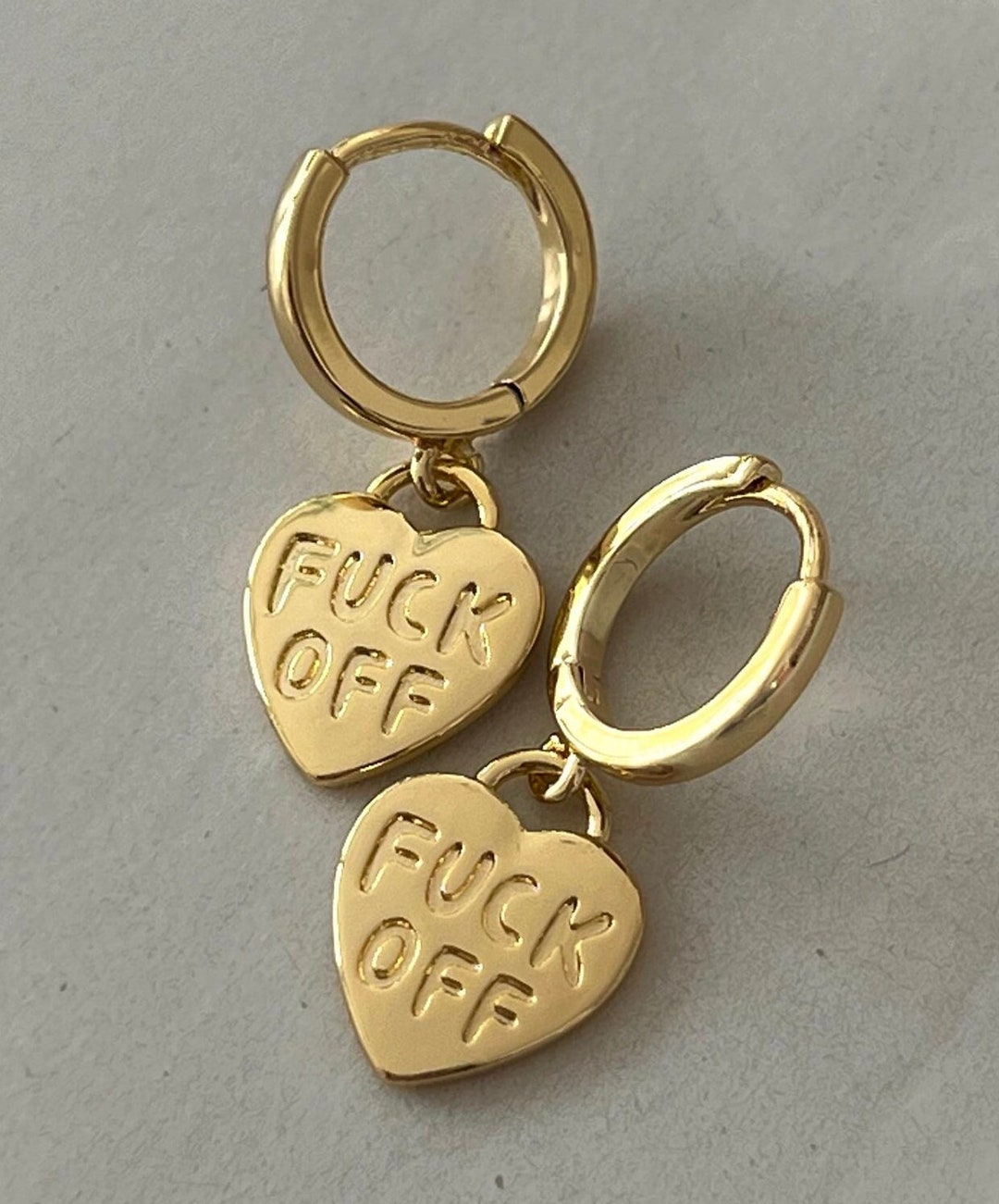 Fuck Off Heart Shaped Gold And Silver Plated Huggie Earrings Packaged In