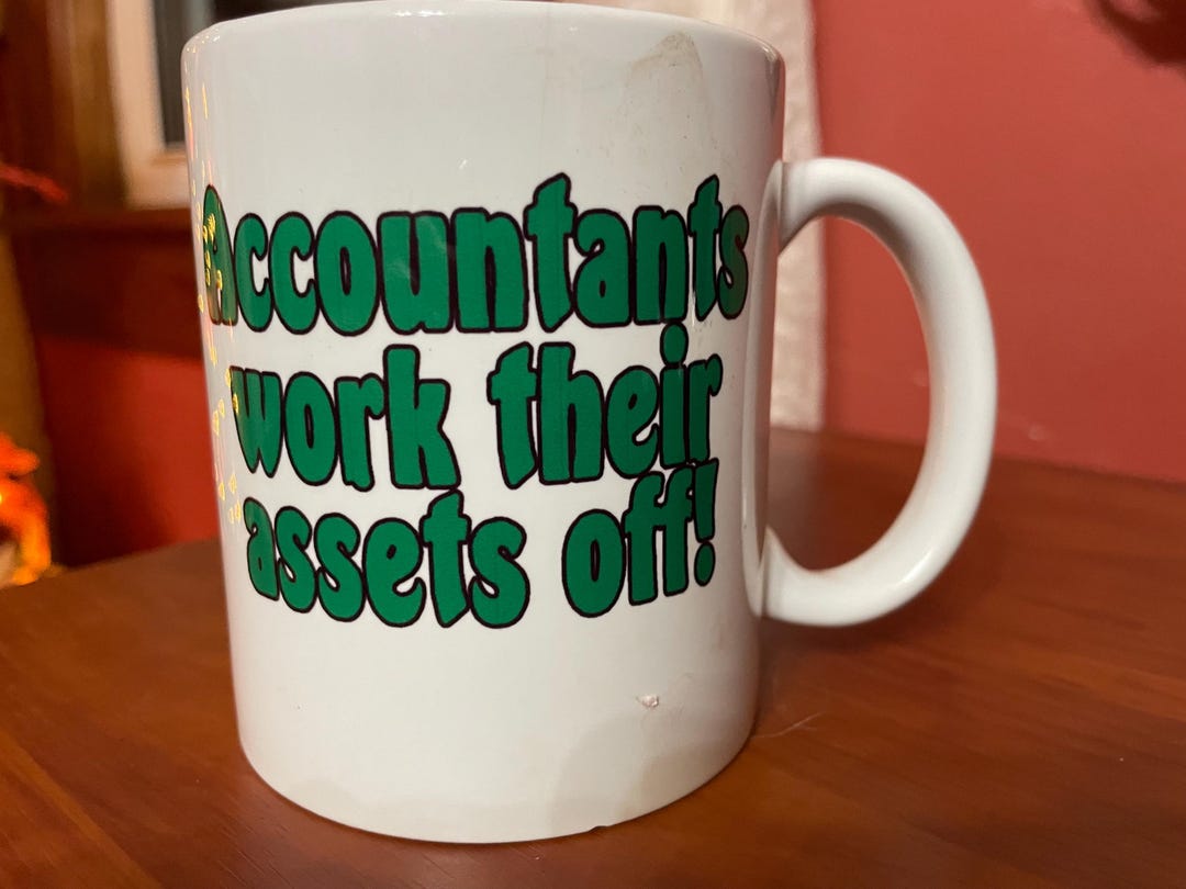 White Ceramic Mug That States “accountants Work Their Assets Off ...