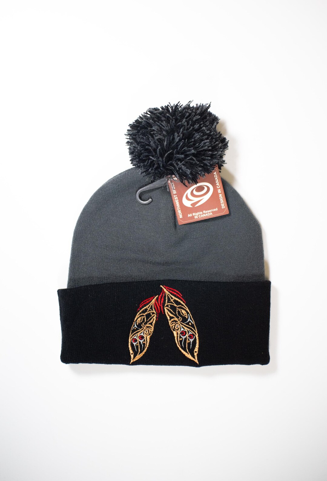 First Nations 'feather' by Gene Suyu Pom Pom Toque Beanie Hat ...
