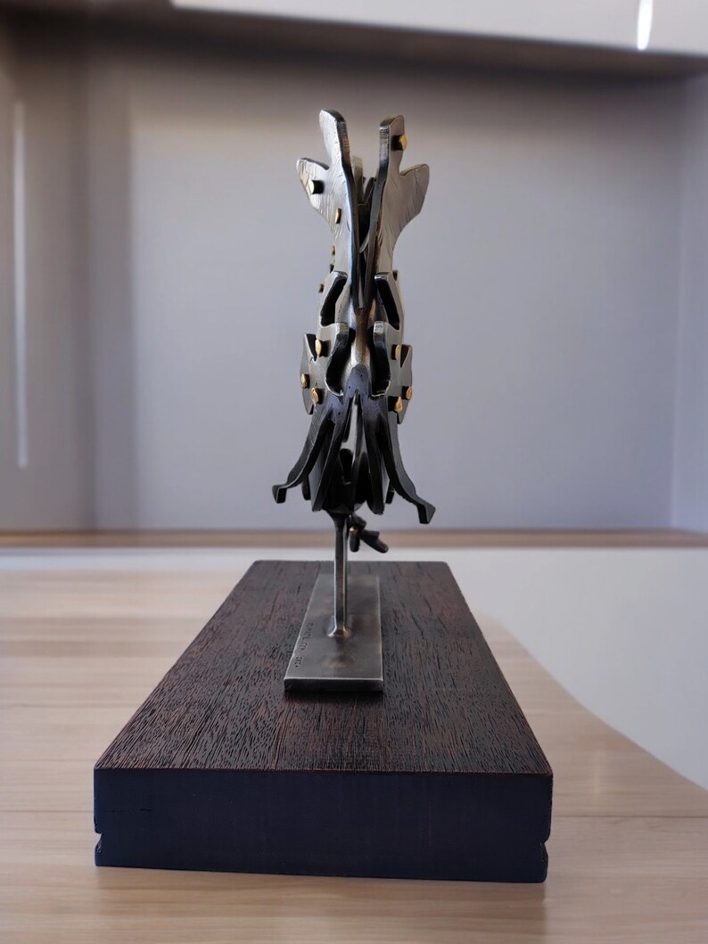 Steel Fish nautilus. Abstract Sculpture is a Decoration That Will Bring ...