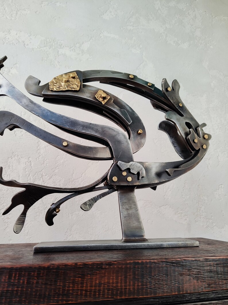 Steel Fish nautilus. Abstract Sculpture is a Decoration That Will Bring ...