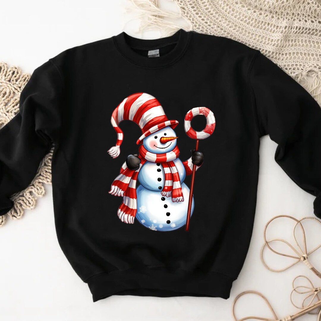 Stay Warm This Christmas With the Snowman Pouring Gift Cozy Crewneck ...