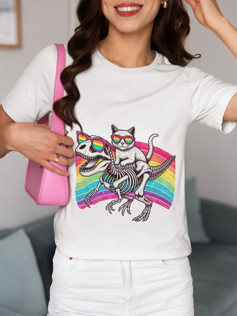 Unisex T-shirt Cat Riding T-rex Skeleton Rainbow Sunglasses, Fun ...