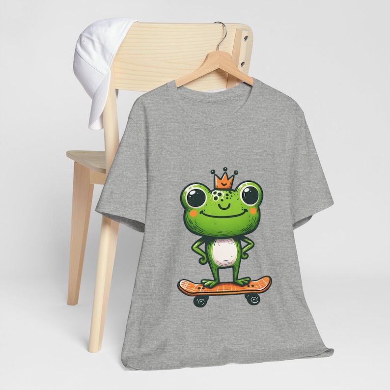 Unisex T-shirt With Cute Cartoon Frog Wearing a Crown on a Skateboard ...