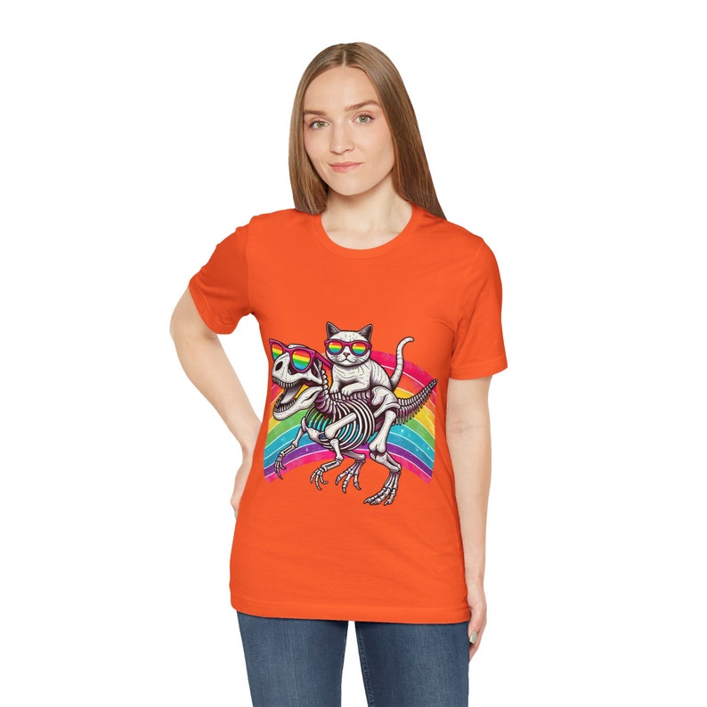 Unisex T-shirt Cat Riding T-rex Skeleton Rainbow Sunglasses, Fun ...