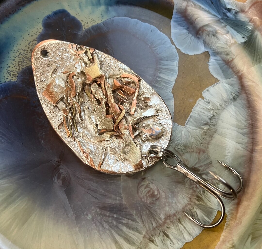 Precious Metal Fishing Lure Lifts the Décor of an Avid Fisherman or ...