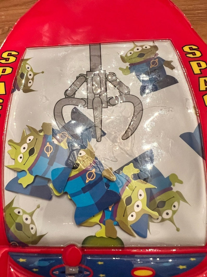 Disney Store RARE Toy Story Alien Claw Machine Zip up Stationary Art ...