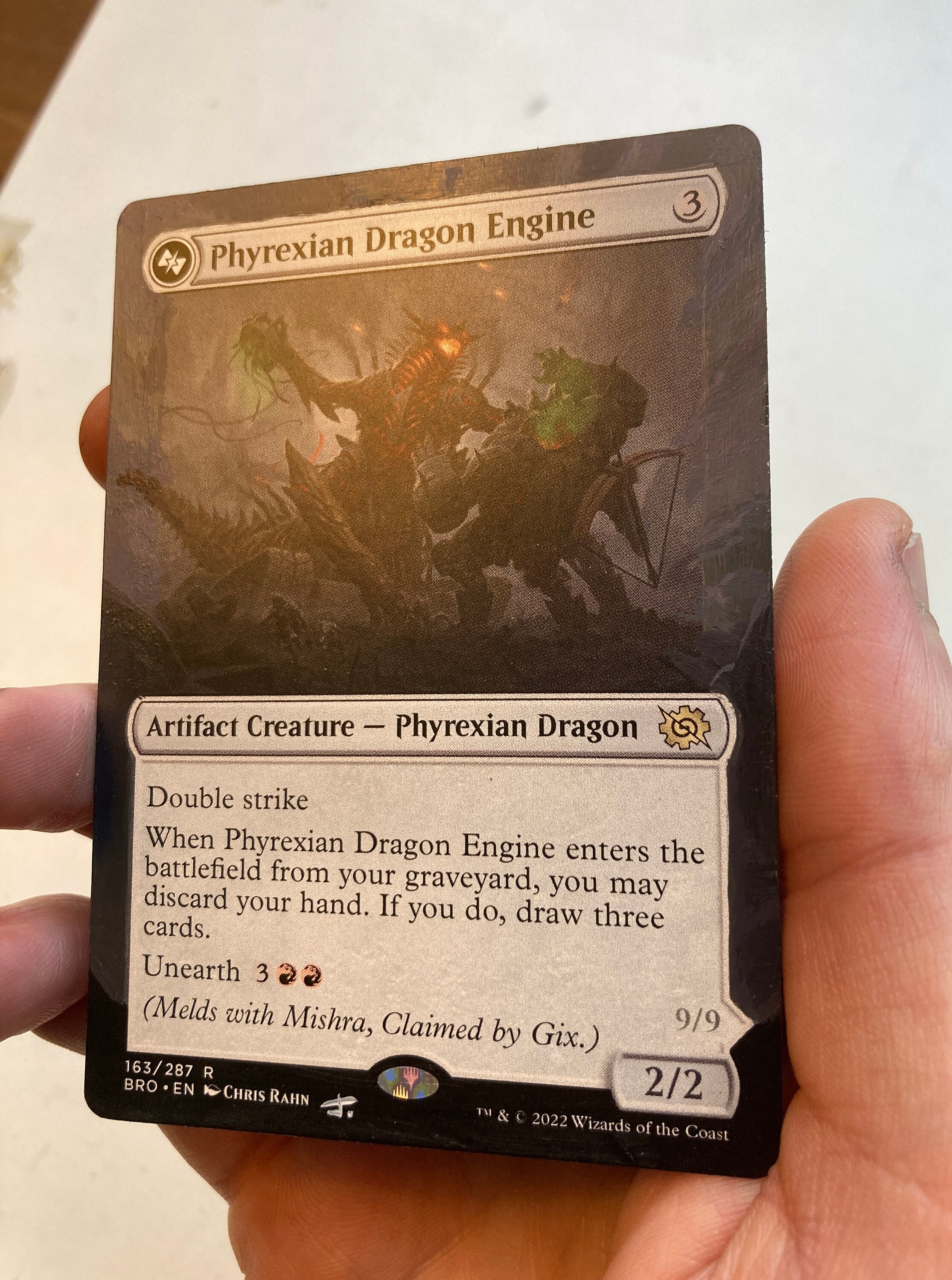 Painted Borderless Alter of Mishra, Claimed by Gix, and Phyrexian Dragon Engine, Which Meld Into ...