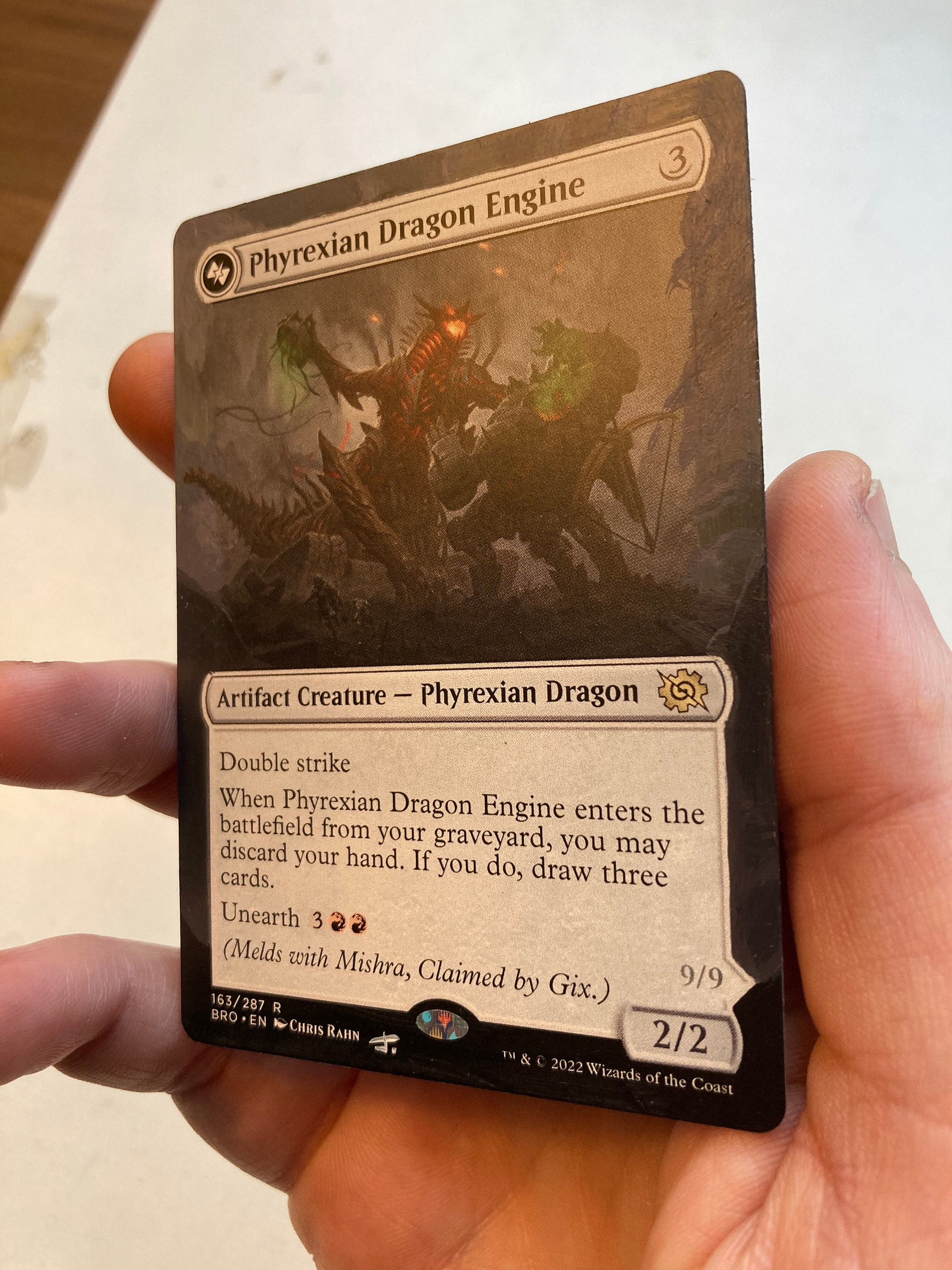 Painted Borderless Alter of Mishra, Claimed by Gix, and Phyrexian Dragon Engine, Which Meld Into ...