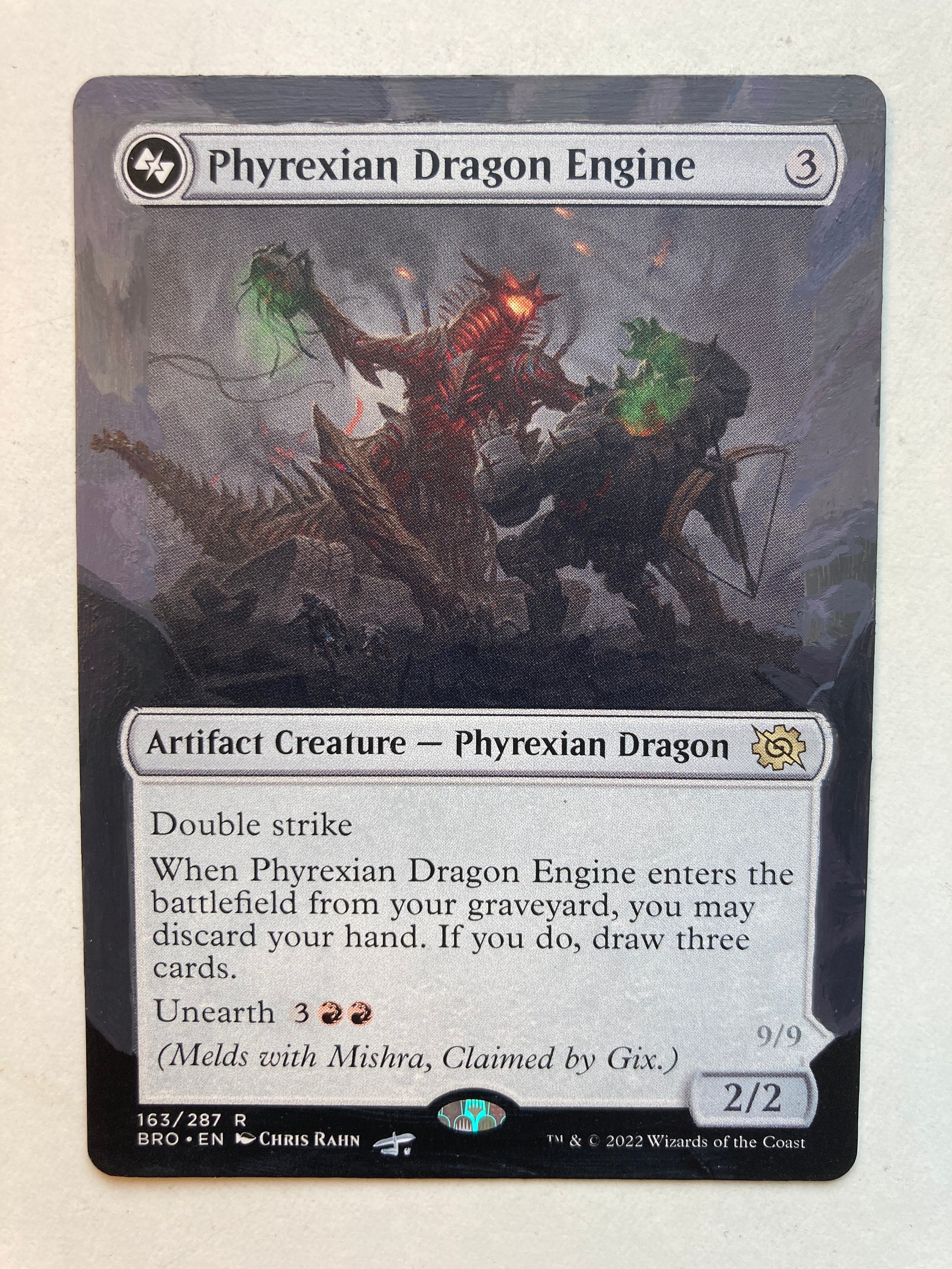 Painted Borderless Alter of Mishra, Claimed by Gix, and Phyrexian Dragon Engine, Which Meld Into ...
