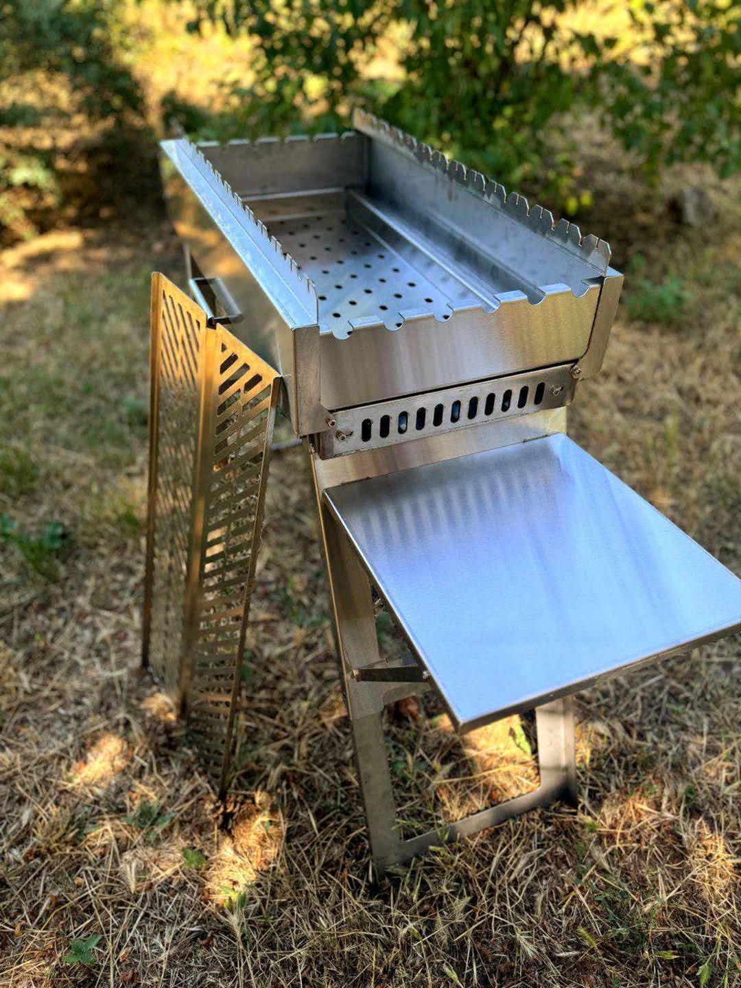 Portable Barbecue Complexes With a Grill Grate, a Side Shelf and a ...
