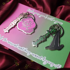 Wicked the Musical Elphaba and Glinda Matching Hard Enamel Keyring Set ...