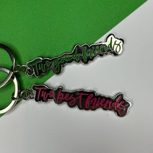 Wicked the Musical Elphaba and Glinda Matching Hard Enamel Keyring Set ...