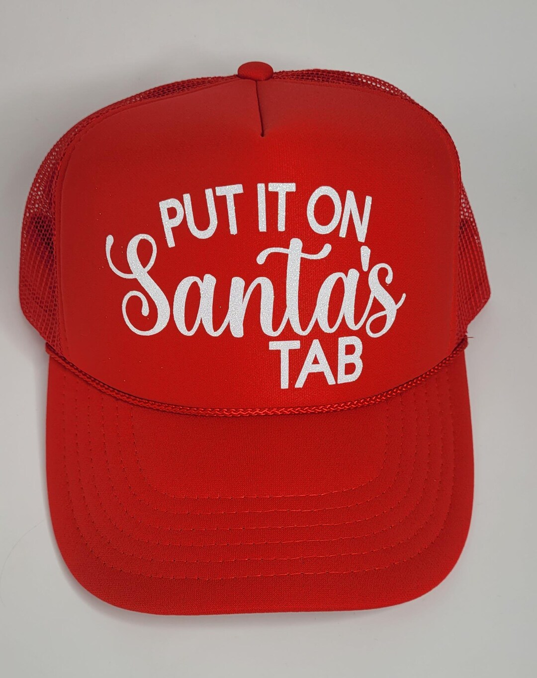 Put It on Santa’s Tab Christmas Trucker Hat - Funny Holiday Gift Hat ...