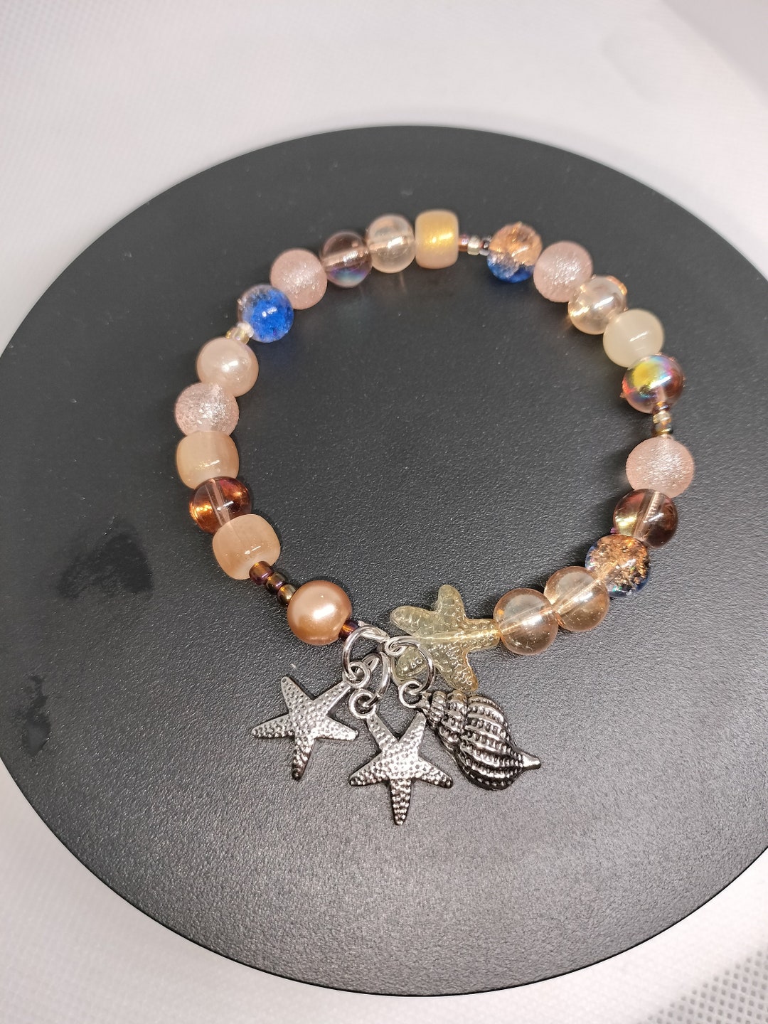 Oceanic Charm Bracelet - Earthy and Aquatic Beads Strung With Silver Sea Stars & a Shell ...