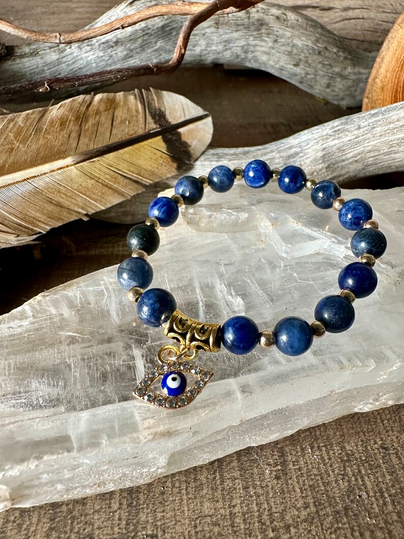 Mystical Radiance: All-seeing Eye Healing Properties Charm Bracelet ...