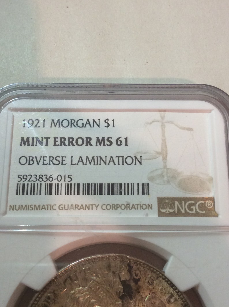 Scarce Mint Error Obverse Lamination MS61 1921 Morgan Silver Dollar Certified by NGC & Given the ...