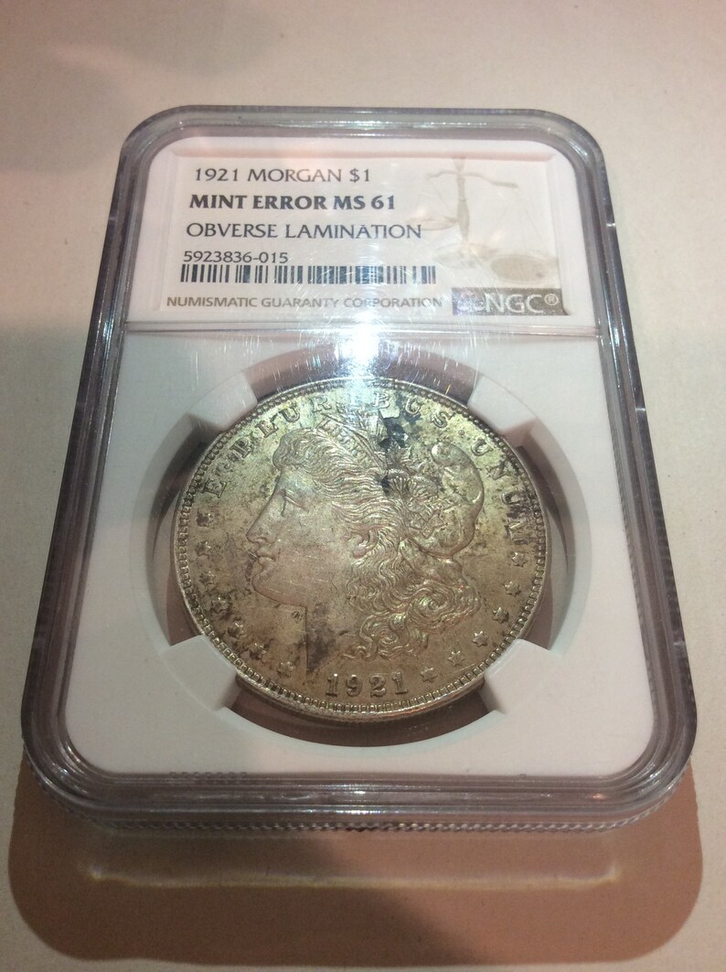 Scarce Mint Error Obverse Lamination MS61 1921 Morgan Silver Dollar Certified by NGC & Given the ...