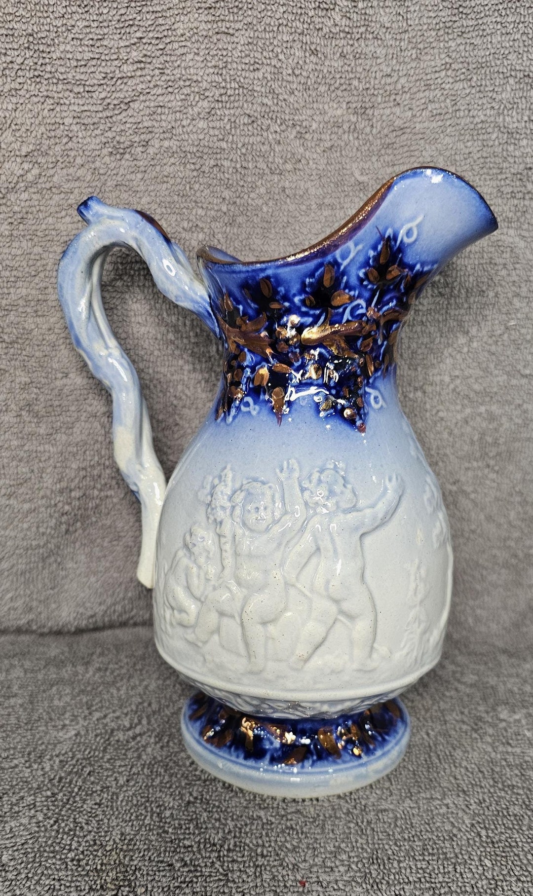 Antique Flow Blue Jug Pitcher With Molded Scenes of Cherubs and Tress ...