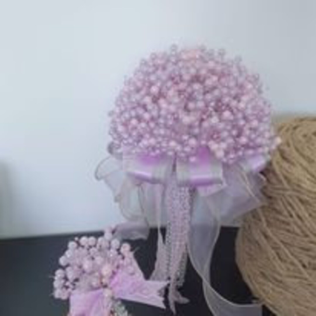 A Beautiful Bouquet of Purple Flowers With a Shiny Ring Nestled Among ...