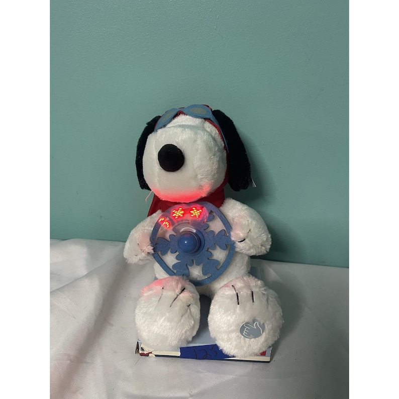 Peanuts Animated Musical Aviator Snoopy Lights up Propeller & Plays ...