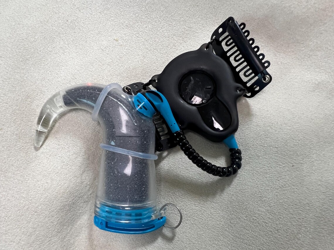 A Resin Case Pin for Securing a Cochlear Implant Compatible With Aqua ...