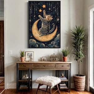 Playful Grey Tabby Cat Kitten on A Crescent Moon Above Clouds Reaching ...