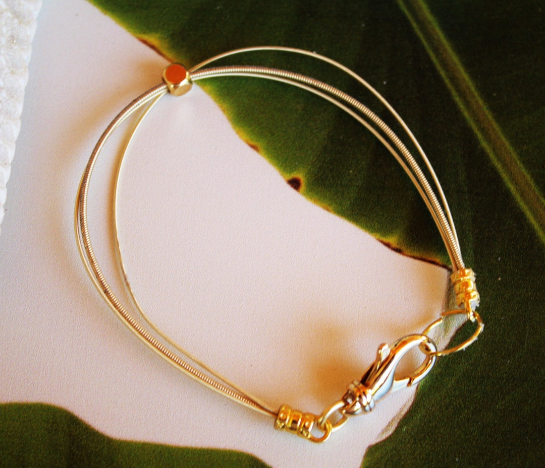 Guitar String Bracelet in Gold - Three Strings and One Floating Gold ...