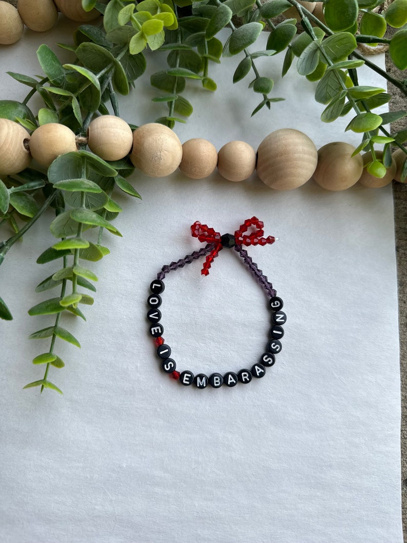 Olivia Rodrigo, Love is Embarrassing Bow Bracelet, GUTS Tour Collection ...