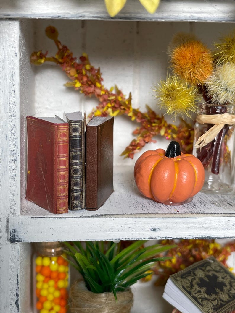 Mini Bookshelf With Fall Themed Decor Including Sunflowers, Pumpkins ...