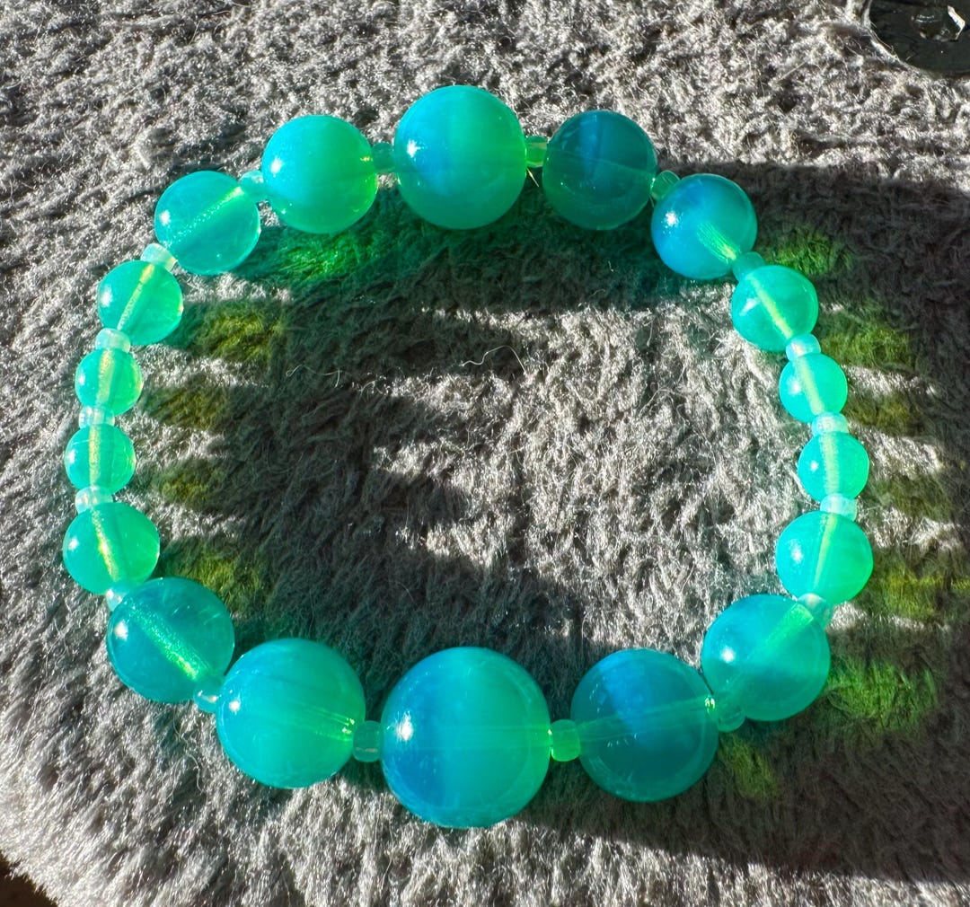 Uranium Glass Graduated Stretch Bracelet - 14mm Smooth Blue Green Opal ...