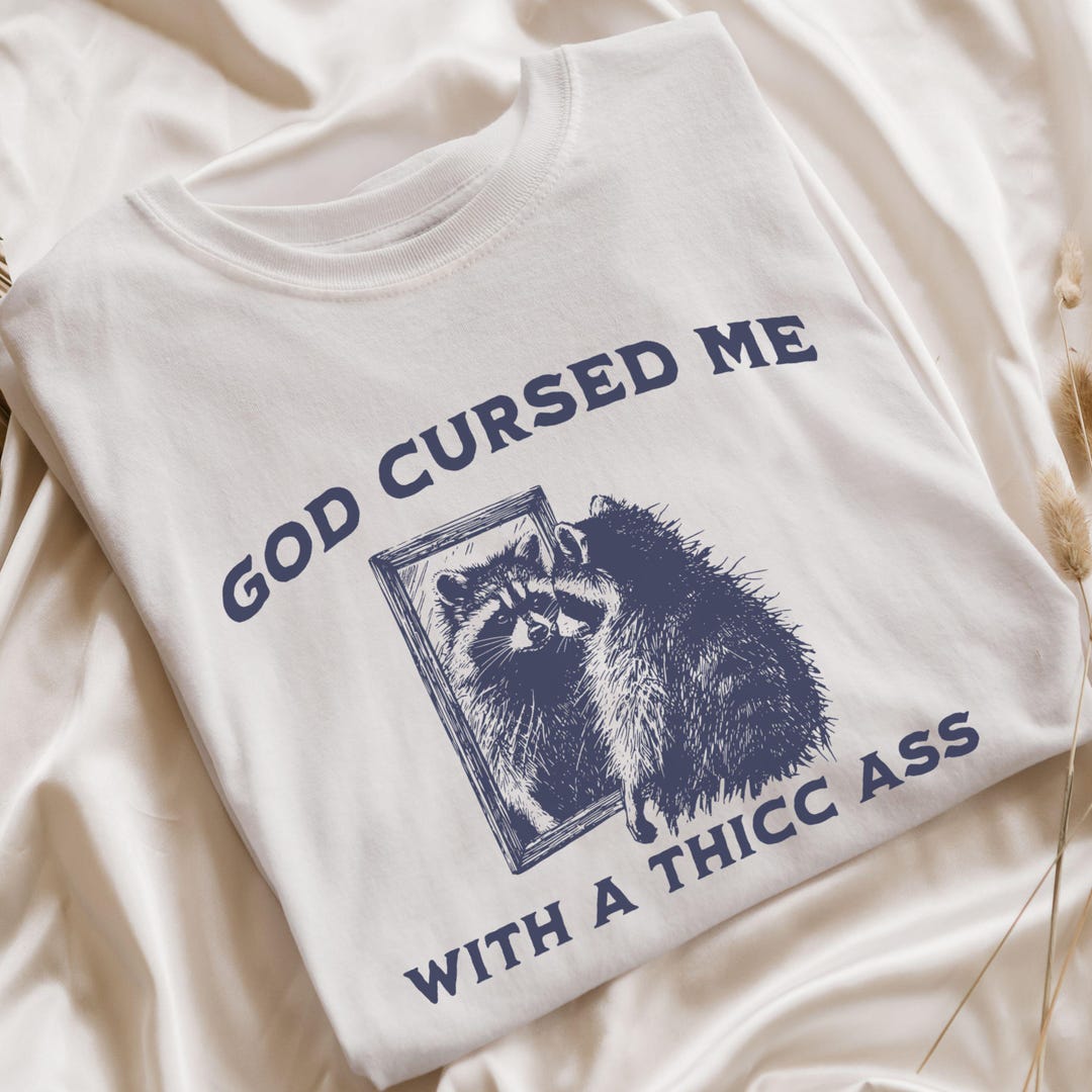 God Cursed Me With A Thicc Ass Funny Raccoon Shirt Vintage Graphic Tee ...