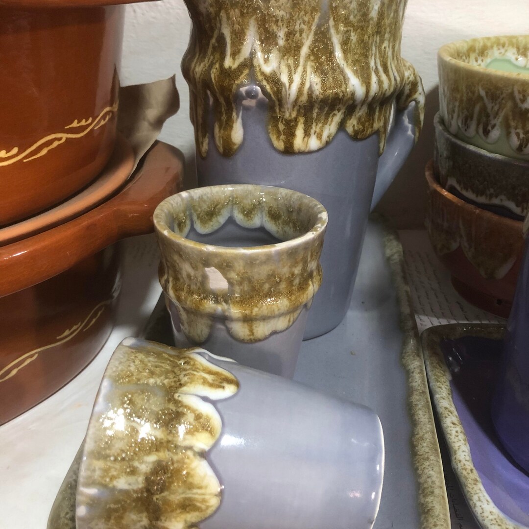 Decorated Tray and Two Decorative Cups With Dripping White Cream and a ...