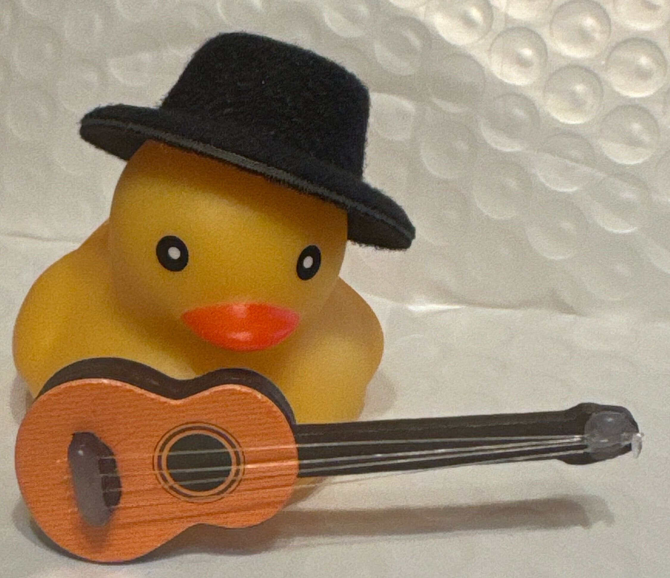 A Rubber Duck Playing a Musical Instrument of Your Choice, Adorned With ...