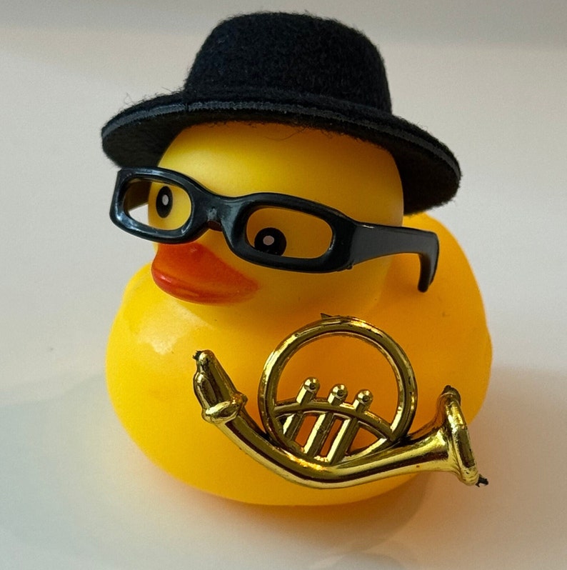 A Rubber Duck Playing a Musical Instrument of Your Choice, Adorned With ...