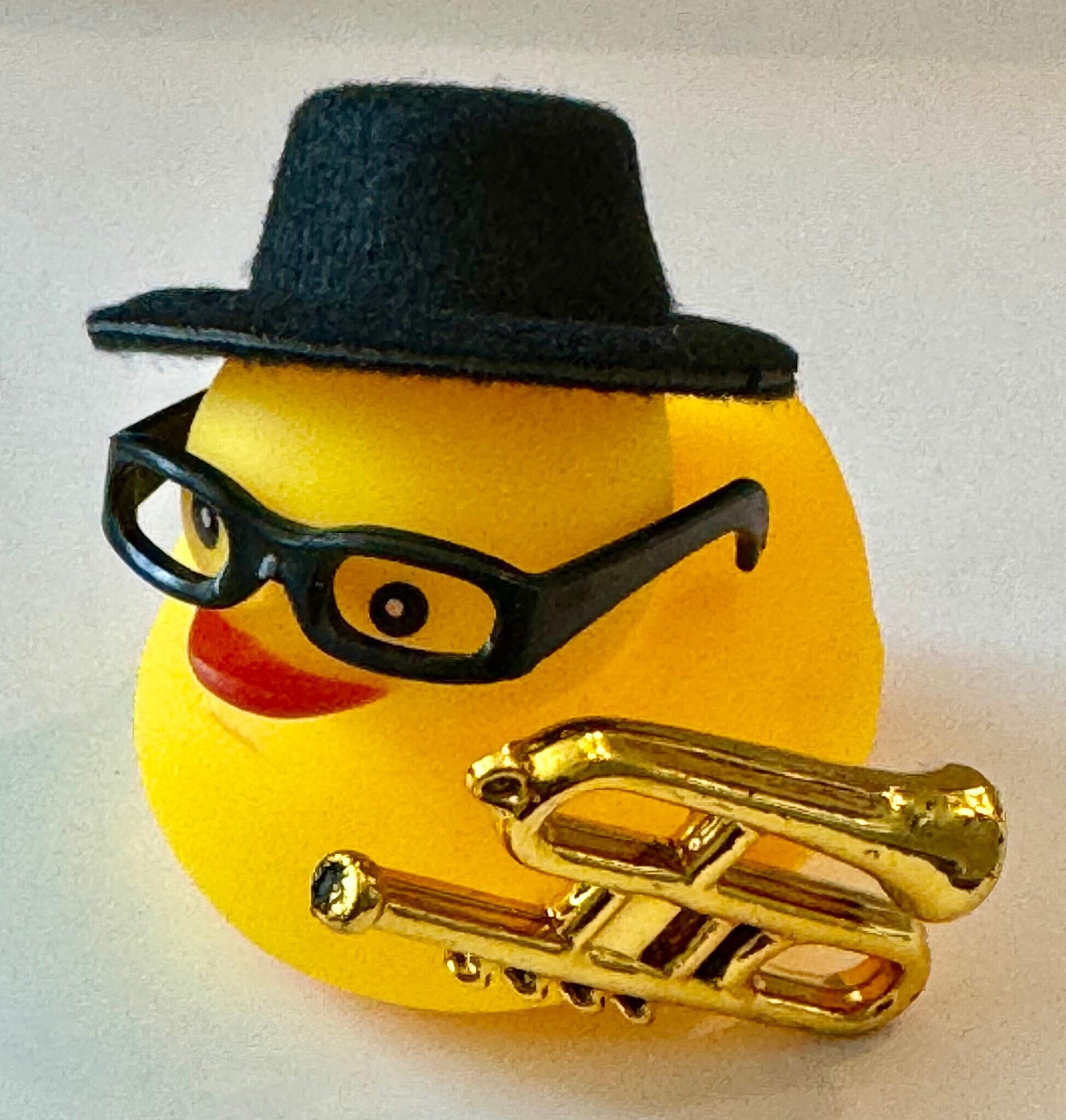 A Rubber Duck Playing a Musical Instrument of Your Choice, Adorned With ...