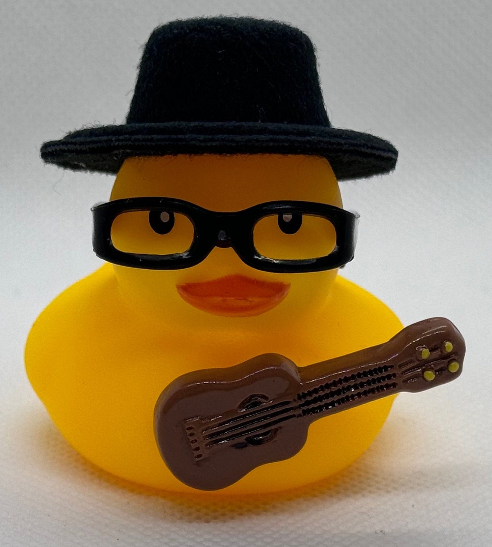 A Rubber Duck Playing a Musical Instrument of Your Choice, Adorned With ...