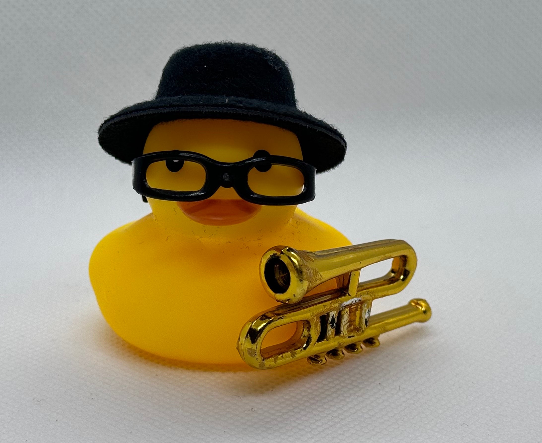 A Rubber Duck Playing a Musical Instrument of Your Choice, Adorned With ...