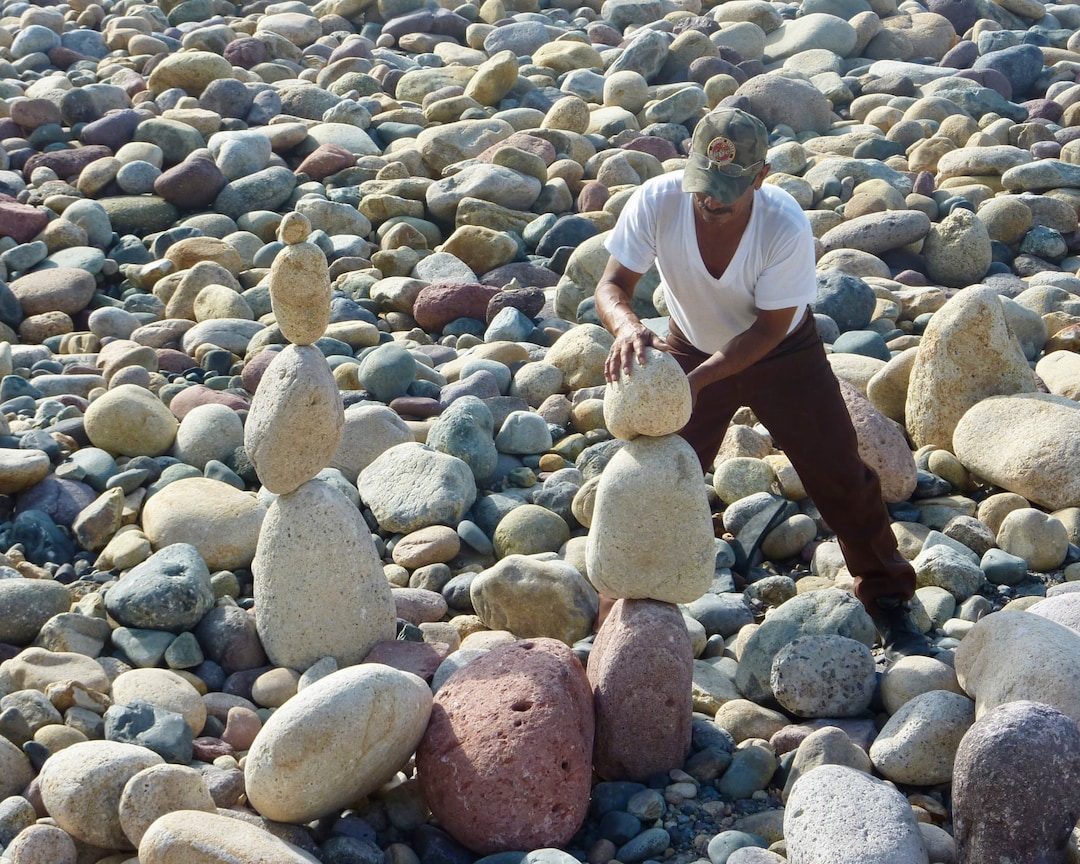 Colorful Rock Stacking Beach Print Showing a Ritual Rock Stacking Beach ...