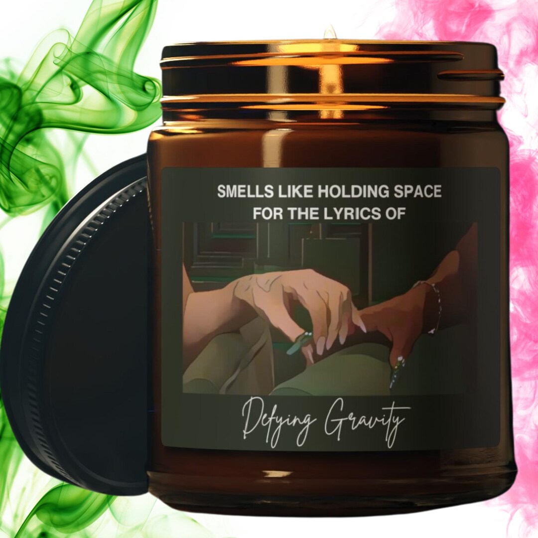 Holding Space for the Lyrics of Defying Gravity Candle Funny Ariana ...
