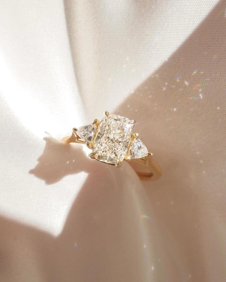 Art Deco Iced Out Cushion Cut Moissanite Trilogy, Trilliant Cut Sides ...
