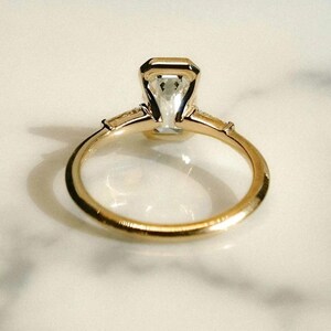 14kt Gold With 3ct Emerald & Tapper Baguette Moissanite Three Stone ...