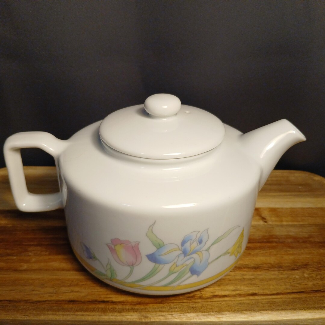 White Teapot With Lid; Floral Design Featuring Tulips, Irises, and ...