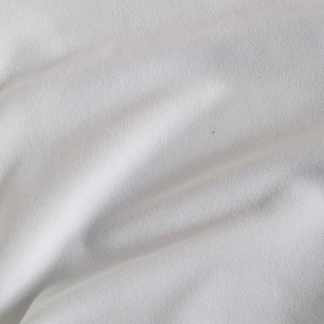 Stretchy White Fabric, a Polyester and Spandex Material, Smooth and ...