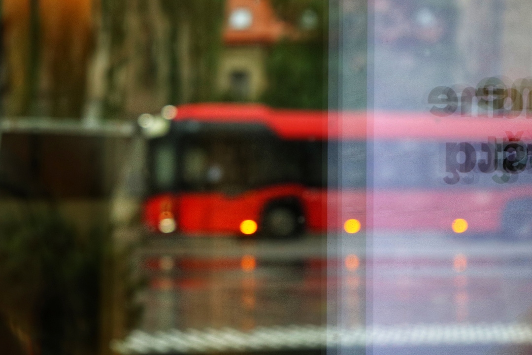 A Digital Picture of a Blurry Red Bus Riding in the Rain in Vilnius - Etsy