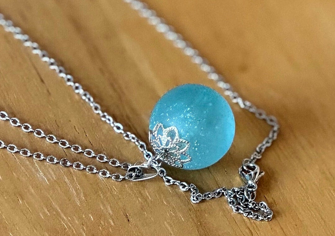 Blue Sphere Necklace Attached With A Silver Toned Flower Topper and a ...